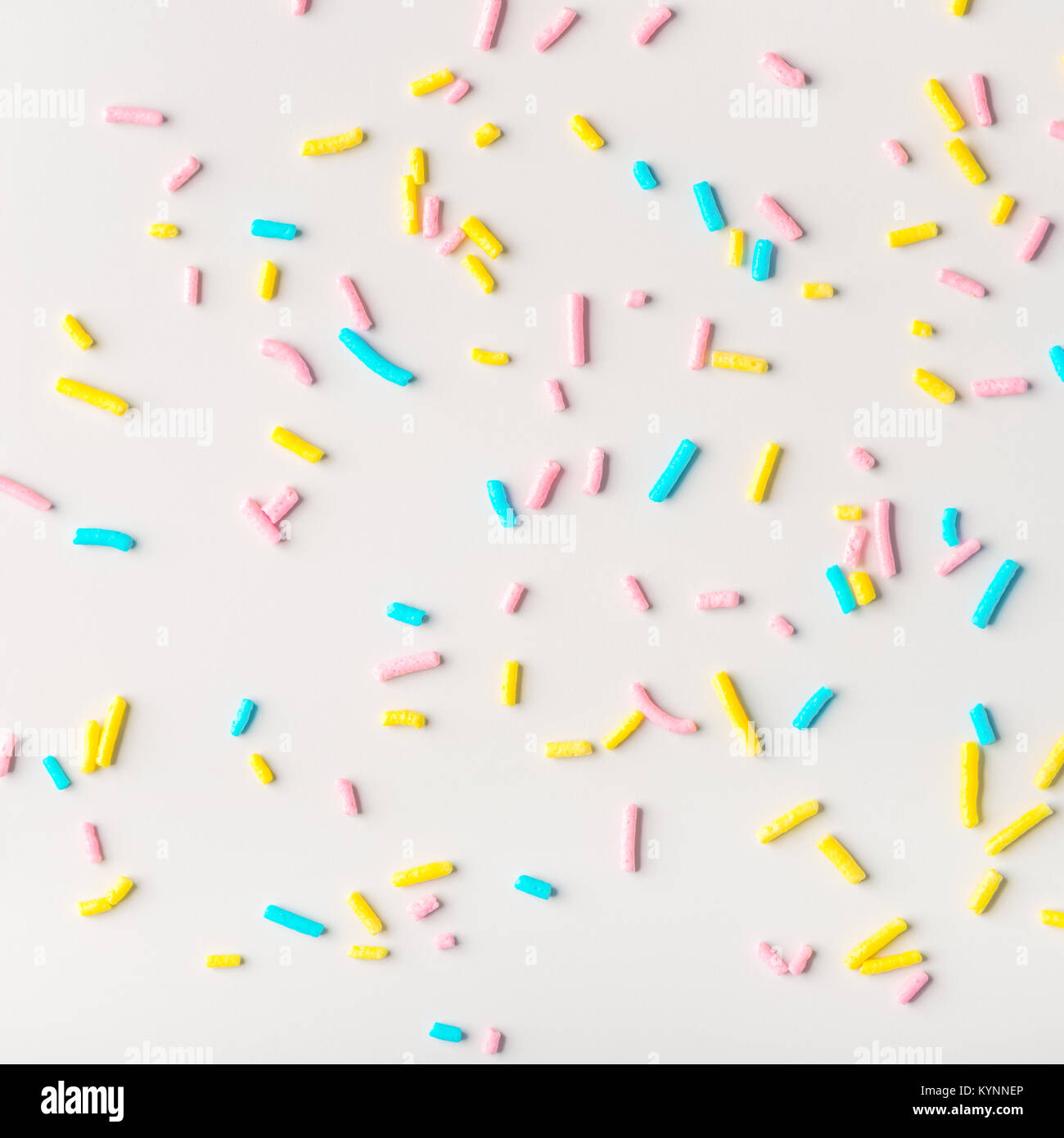colorful sprinkles on white background, flat lay Stock Photo - Alamy