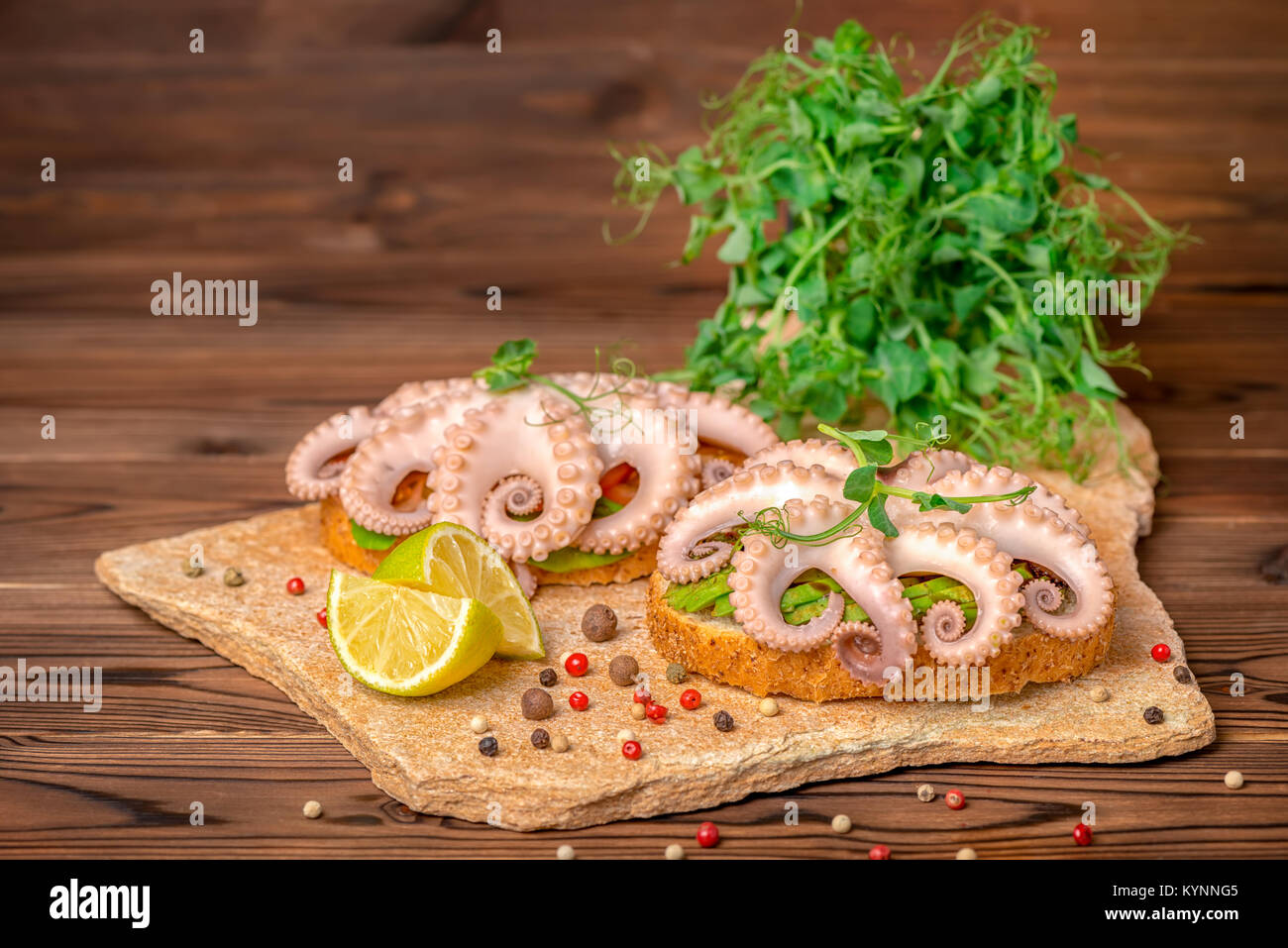 sandwiches with octopus and bread toast decorated lime, bunch of sprigs ...