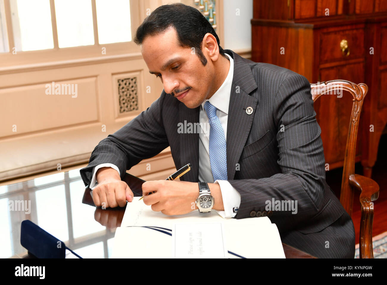 Qatari Foreign Minister Sheikh Mohammed bin Abdulrahman Al Thani signs ...
