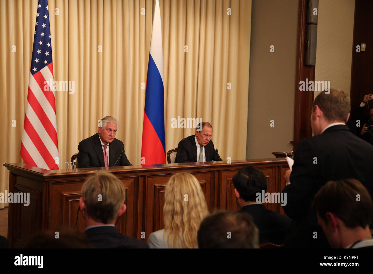 Secretary of State Rex Tillerson listens as Associated Press journalist ...