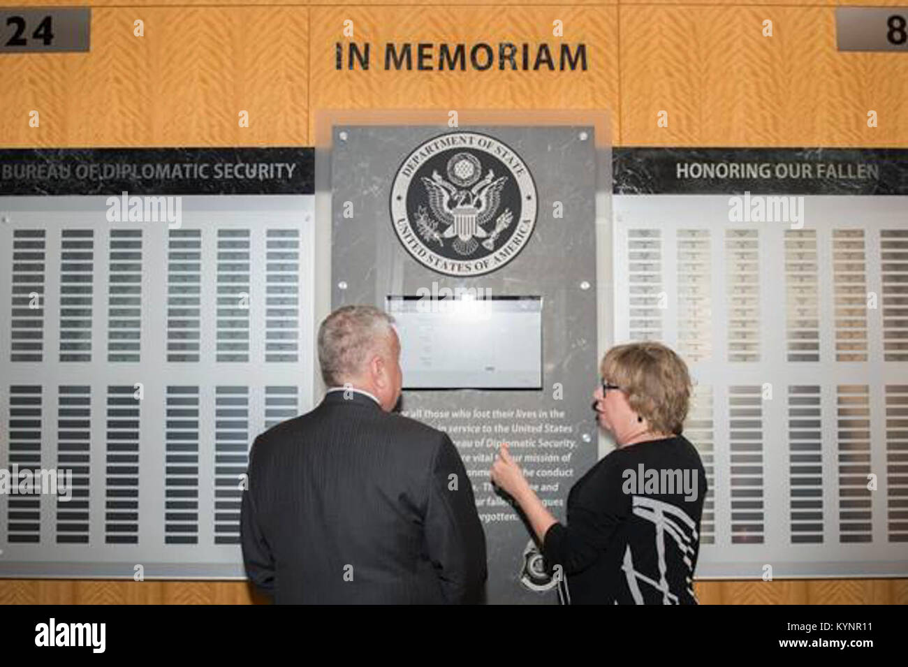A Diplomatic Security staffer demonstrates security procedures to ...