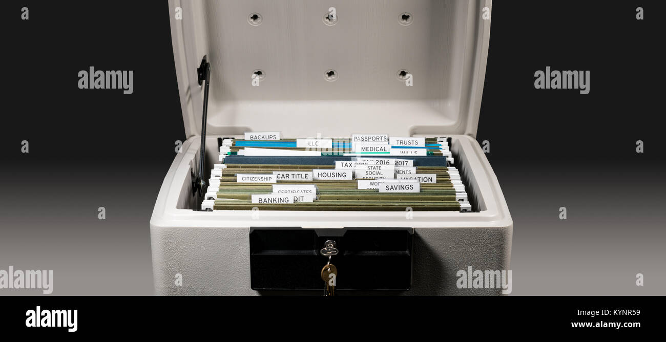 Home filing system for taxes organized in folders Stock Photo - Alamy