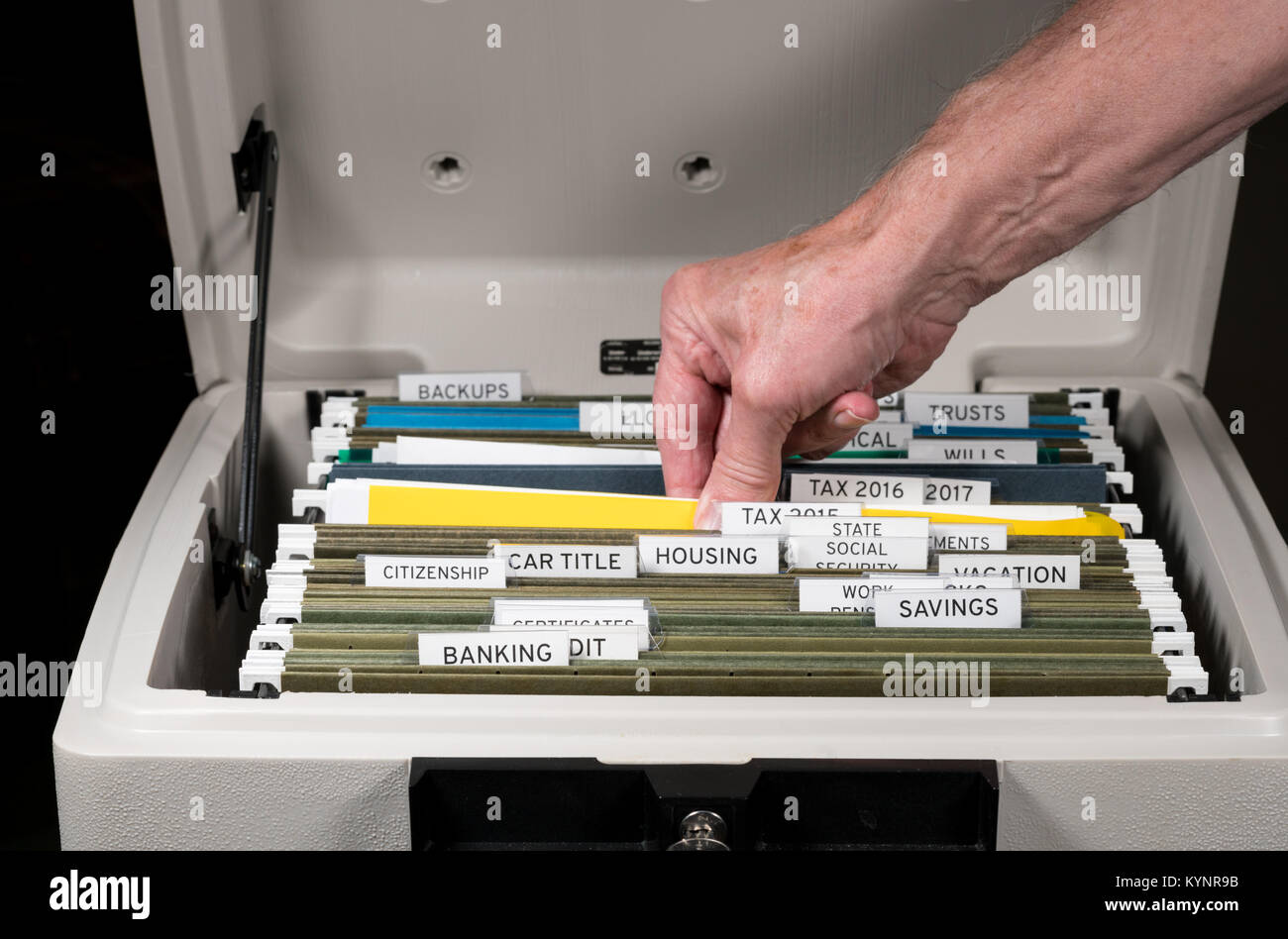 Home filing system for taxes organized in folders Stock Photo - Alamy