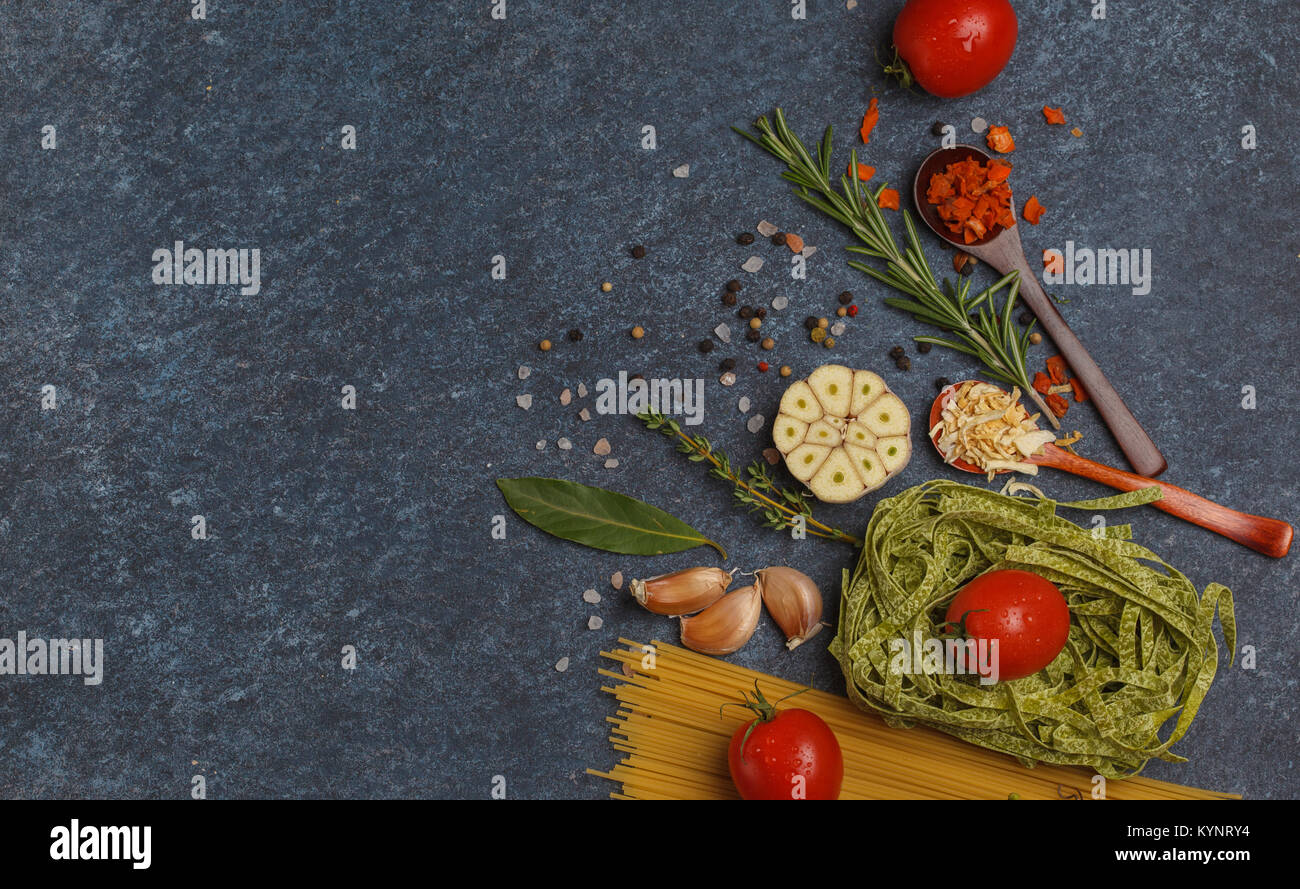 Selection of spices, pasta and greens. Ingredients for cooking pasta ...
