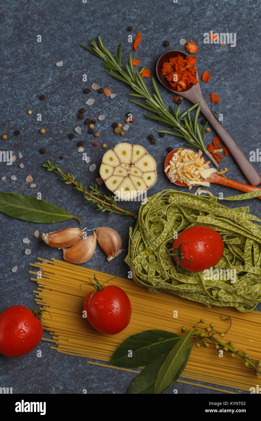 Selection of spices, pasta and greens. Ingredients for cooking pasta ...