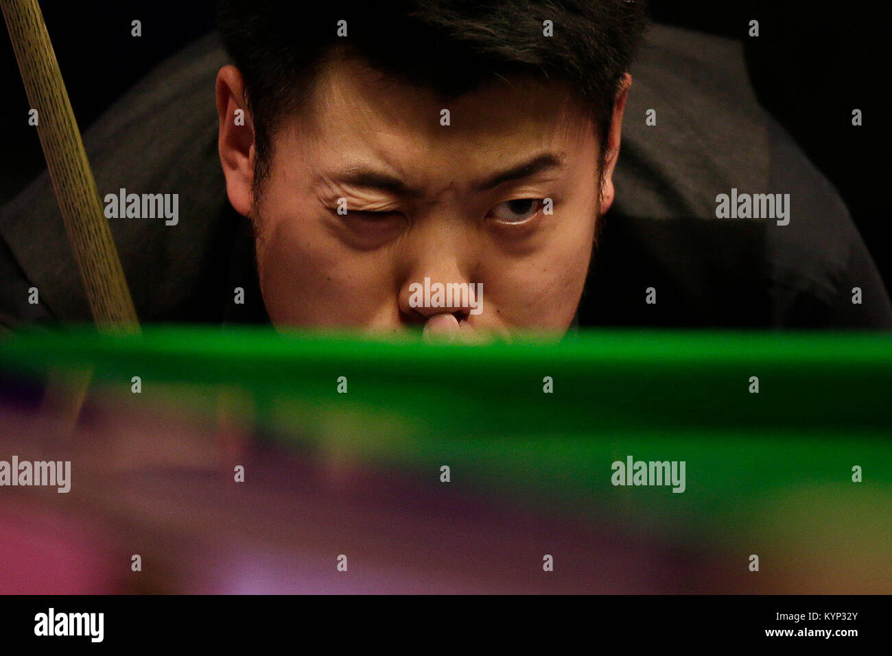 London, UK. 15th Jan, 2018. Liang Wenbo of China looks across the table ...