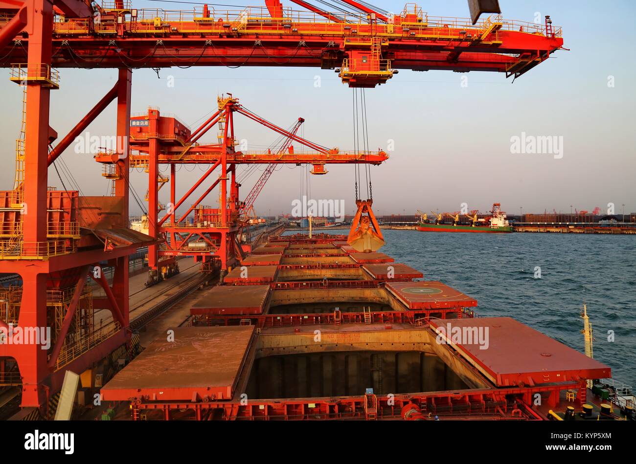 Shijiazhuang. 14th Jan, 2018. A cargo ship is seen at an ore dock of ...