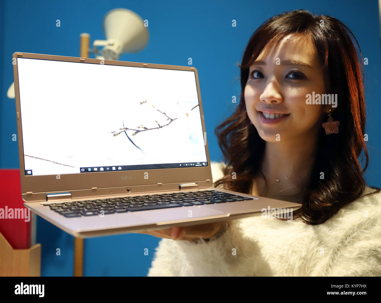 Tokyo, Japan. 16th Jan, 2018. A model displays Chinese computer giant ...