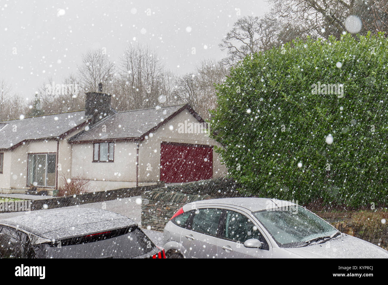Cumbria, UK. 16th Jan, 2018. UK Weather. Midday snowing Windermere ...