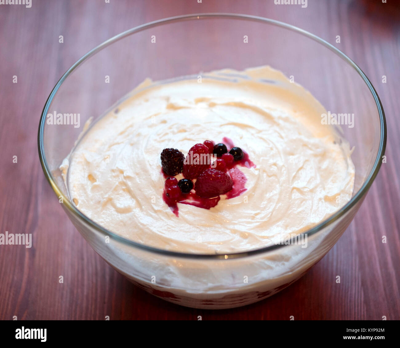 Junket dessert with wild berries on top Stock Photo - Alamy