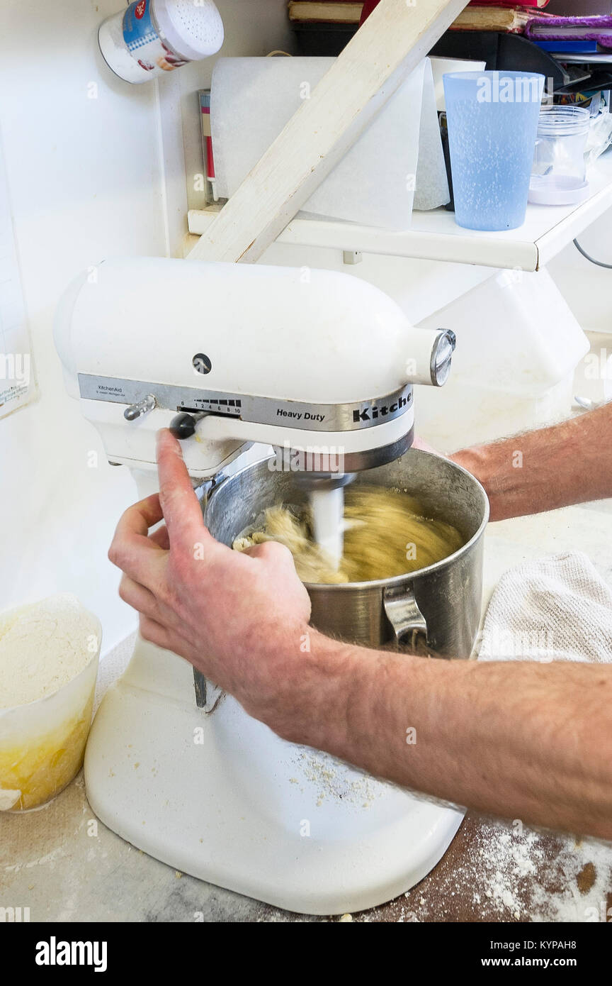Food preparation - a chef mixing dough in a restaurant kitchen Stock ...