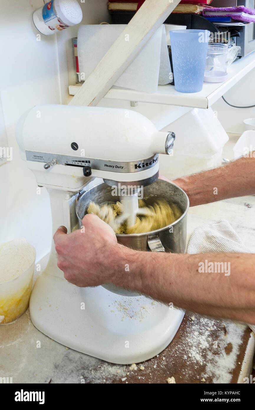 Food preparation - a chef mixing dough in a restaurant kitchen Stock ...