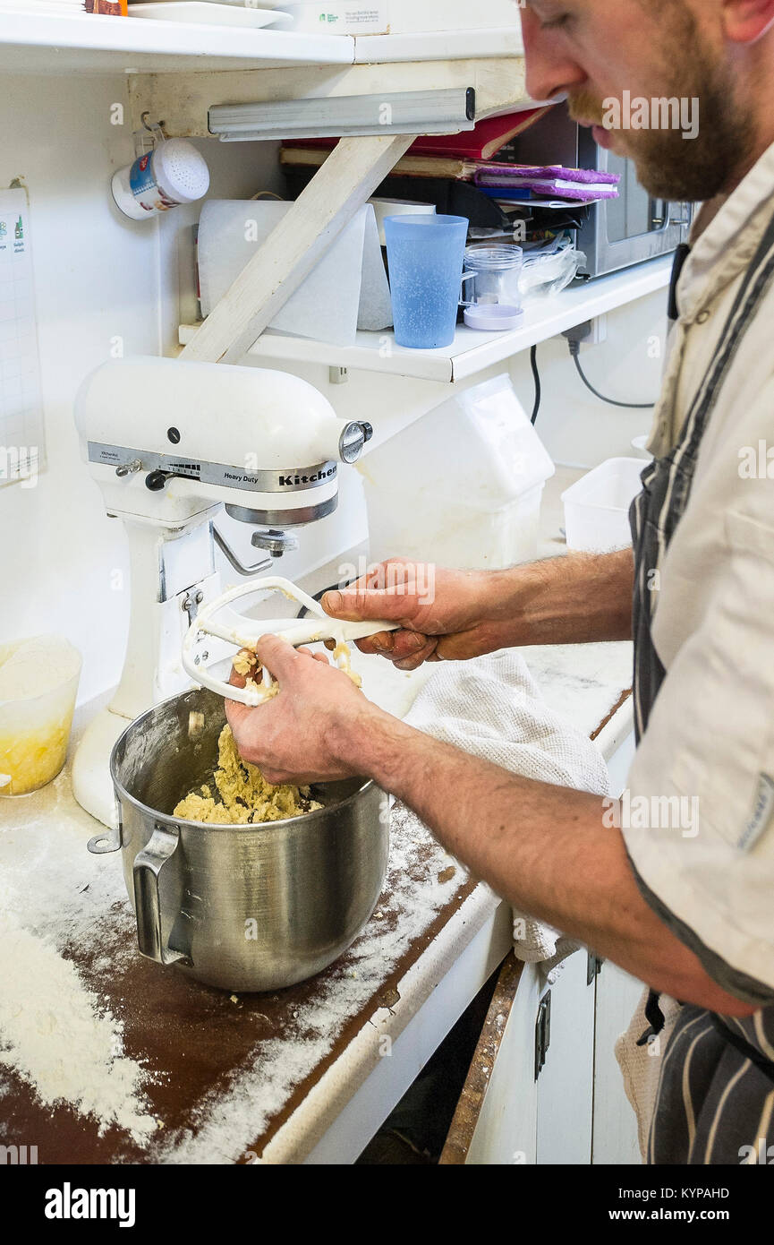 Food preparation - a chef mixing dough in a restaurant kitchen Stock ...