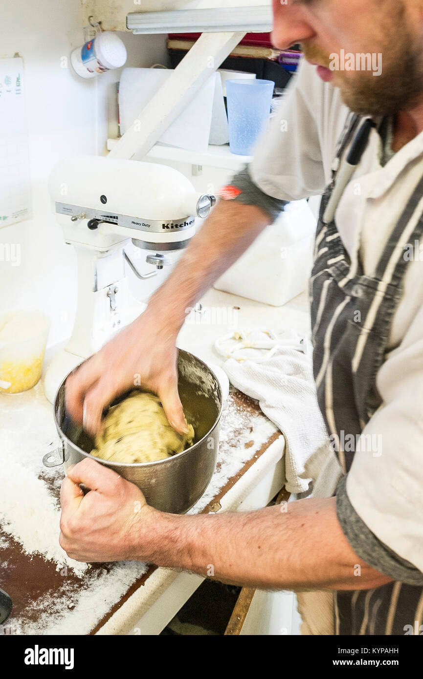 Food preparation - a chef mixing dough in a restaurant kitchen Stock ...