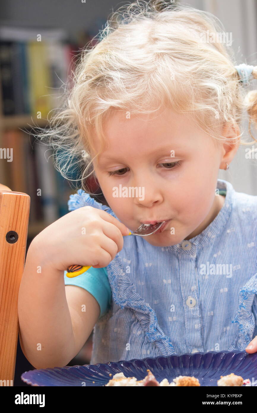 Cute little girl eating hi-res stock photography and images - Alamy
