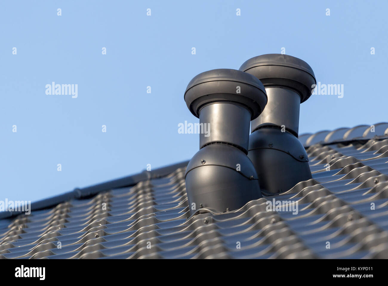 Ventilation chimneys on roof of a house Stock Photo - Alamy