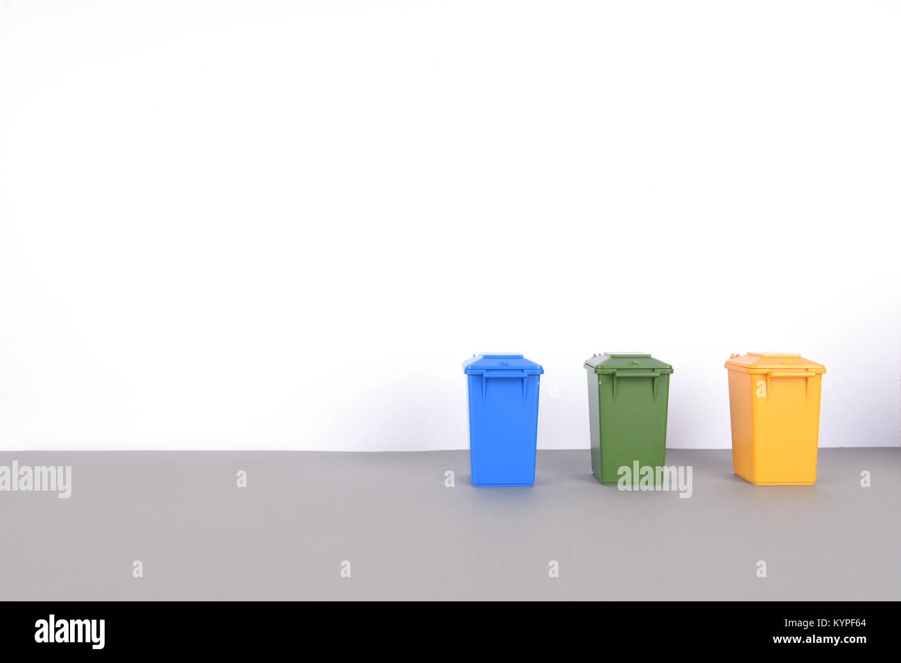 Colorful recycle bins on white background Stock Photo - Alamy