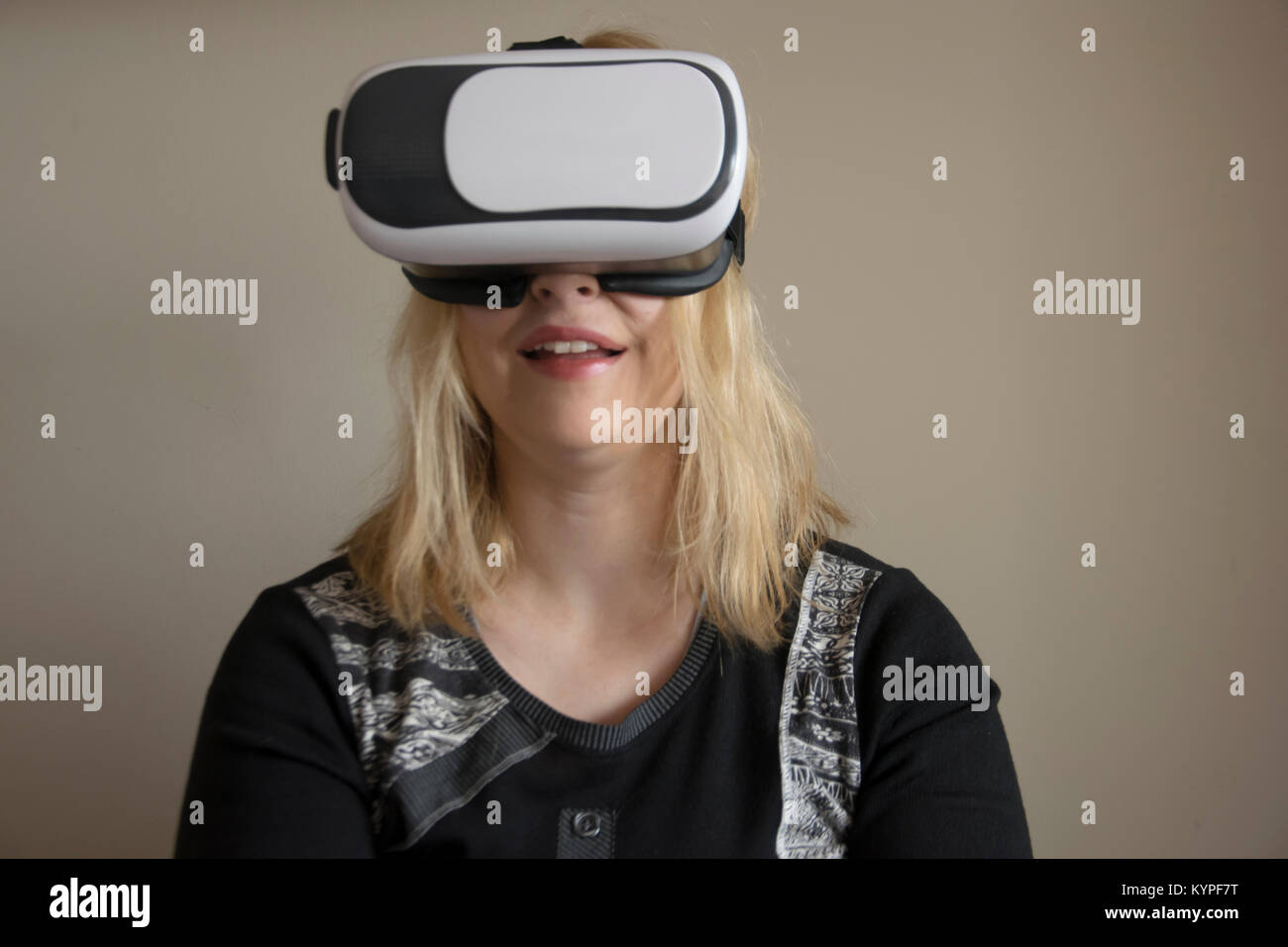 Woman using VR headset Stock Photo - Alamy