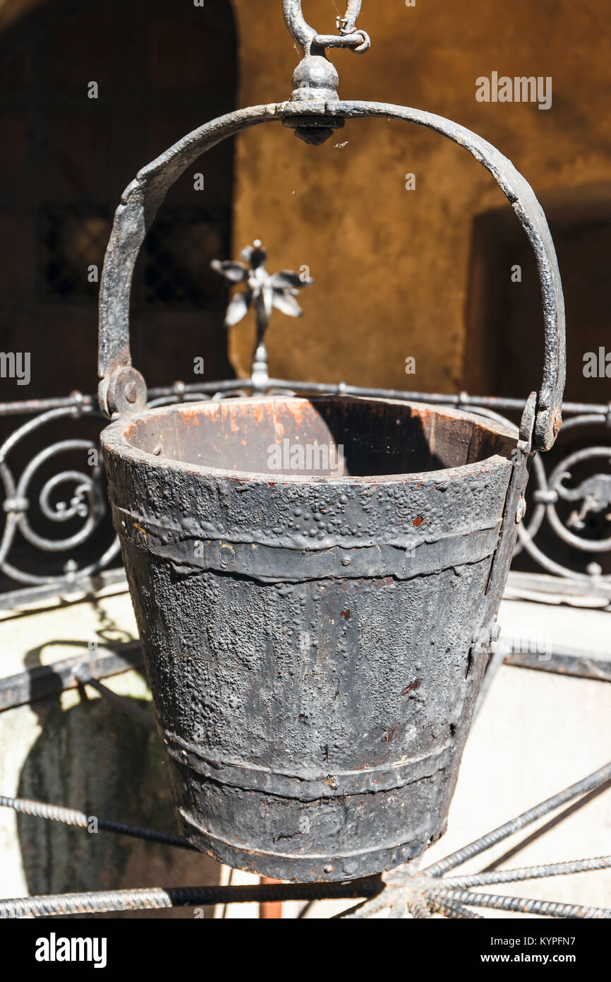 A water well with an old bucket, close up Stock Photo - Alamy