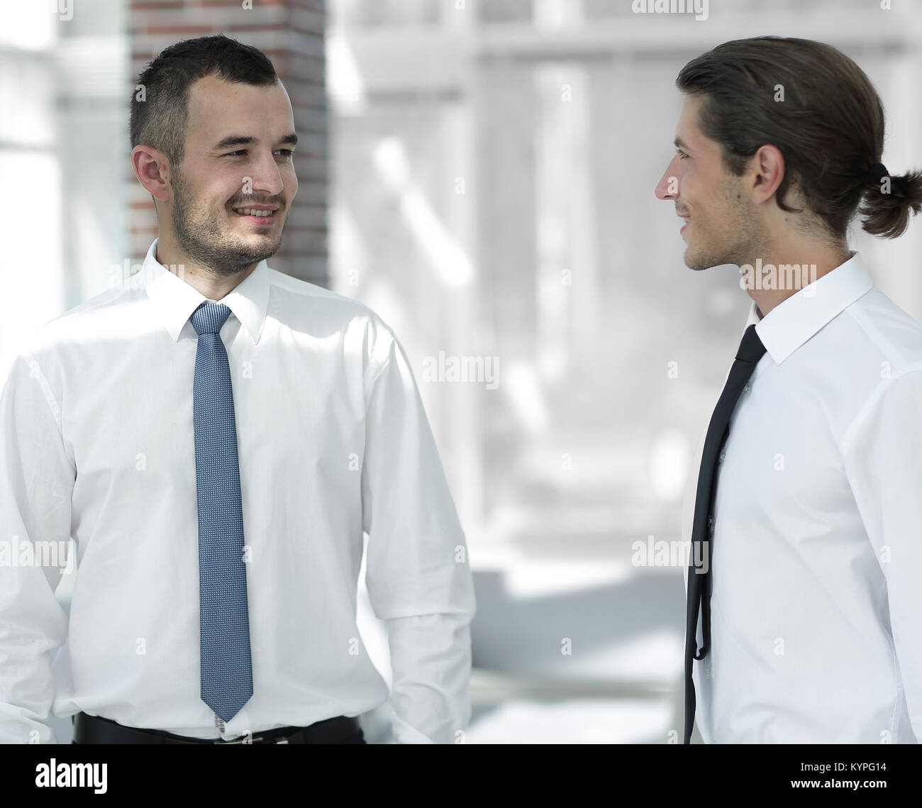 employees are talking ,standing in the office Stock Photo - Alamy