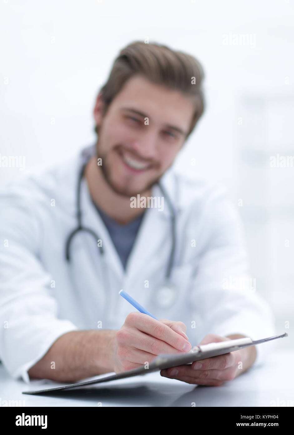 background image of a doctor writing out a prescription Stock Photo - Alamy