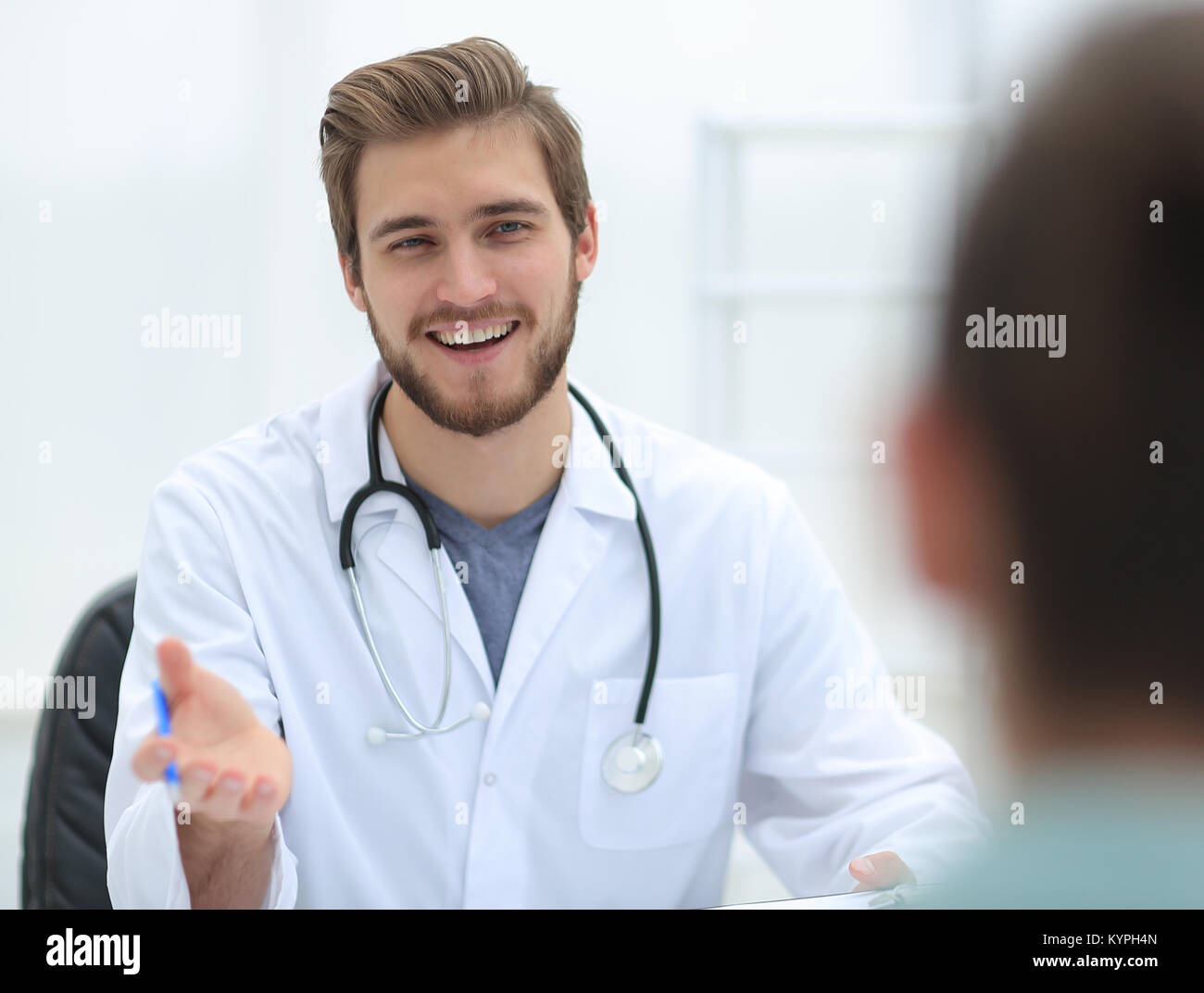closeup.doctor writing a prescription to her patient Stock Photo - Alamy
