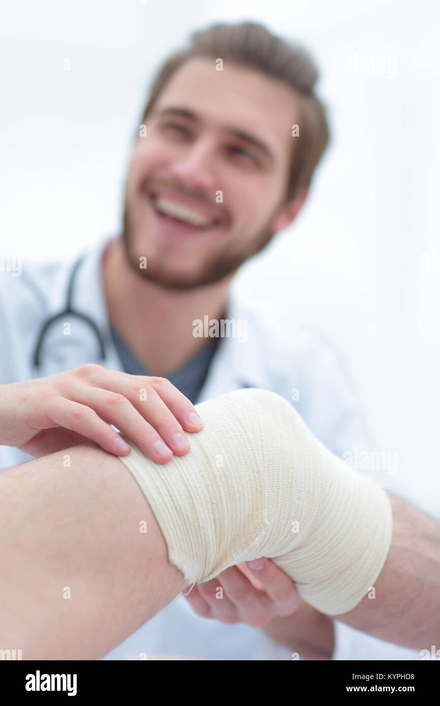 closeup of a doctor examining injured leg of the patient Stock Photo ...