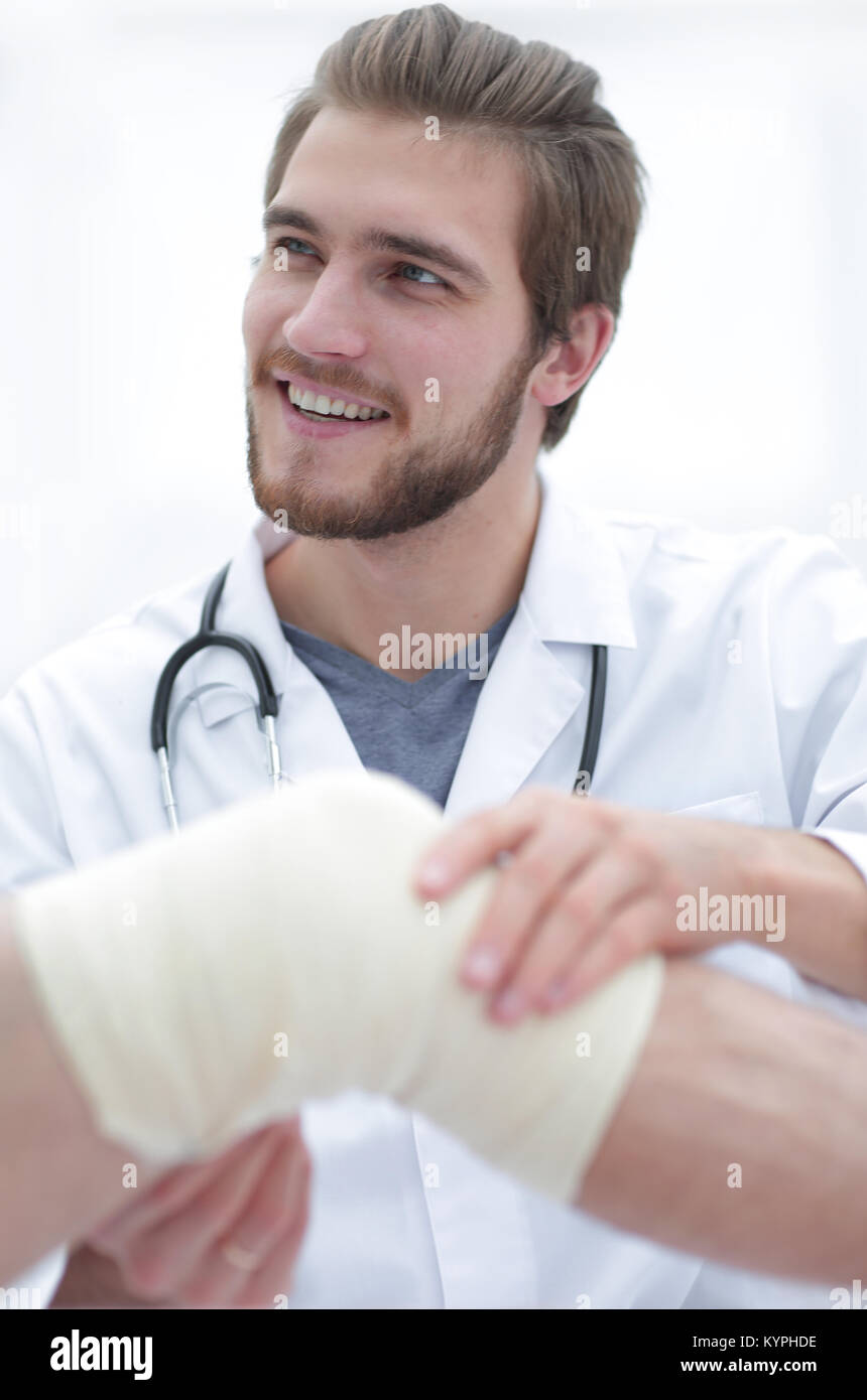 closeup of a doctor examining injured leg of the patient Stock Photo ...