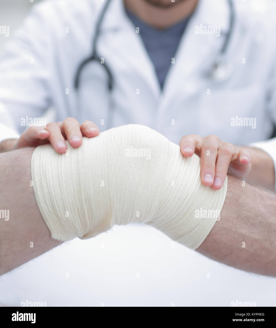 Applying bandage to knee hi-res stock photography and images - Alamy
