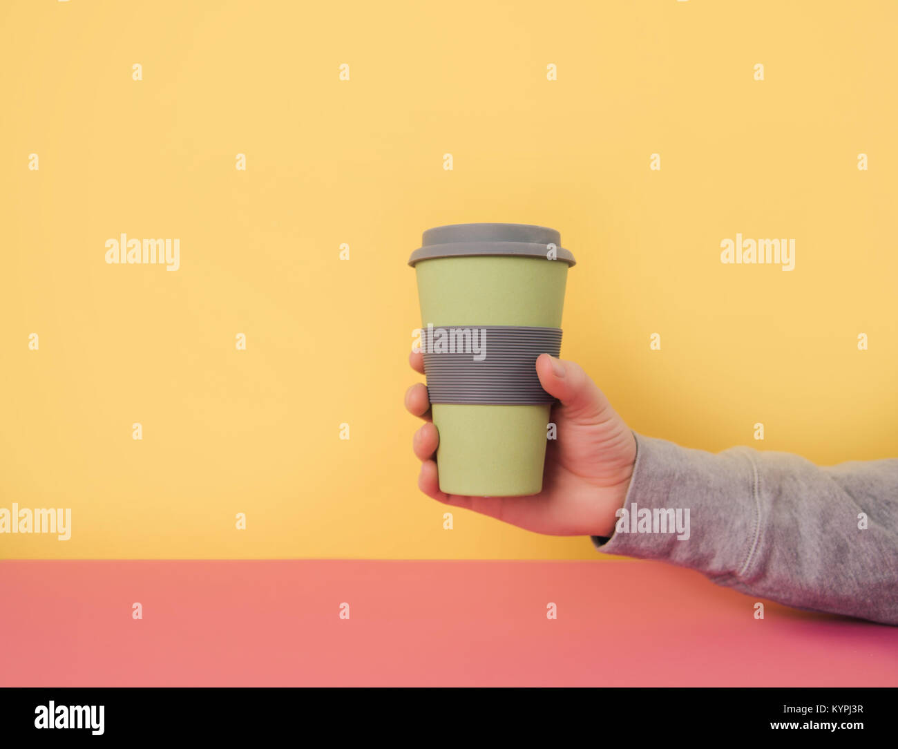 Hand holding take away coffee cup Stock Photo - Alamy