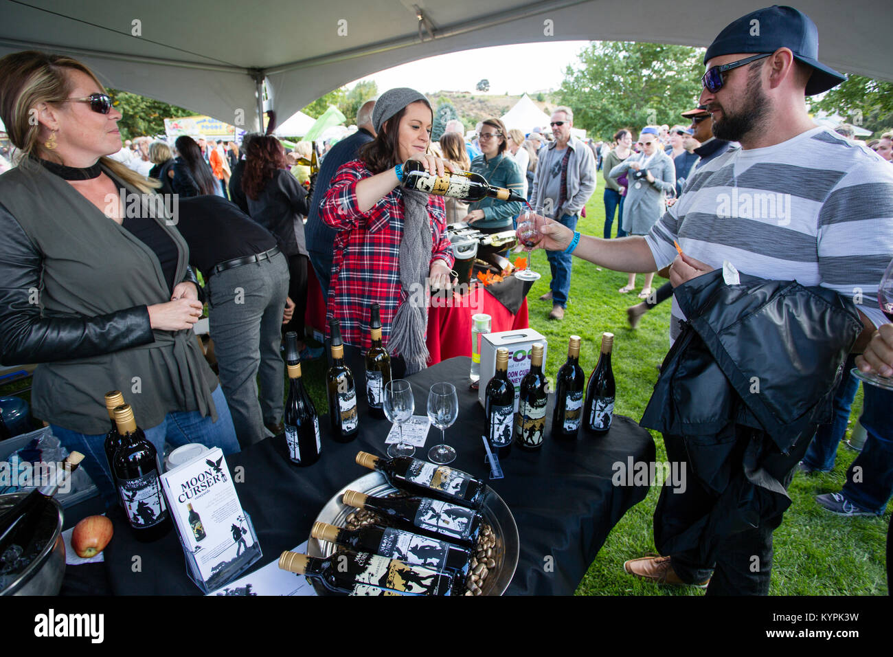 Visting attendees tasting the various wines that are on display at the ...