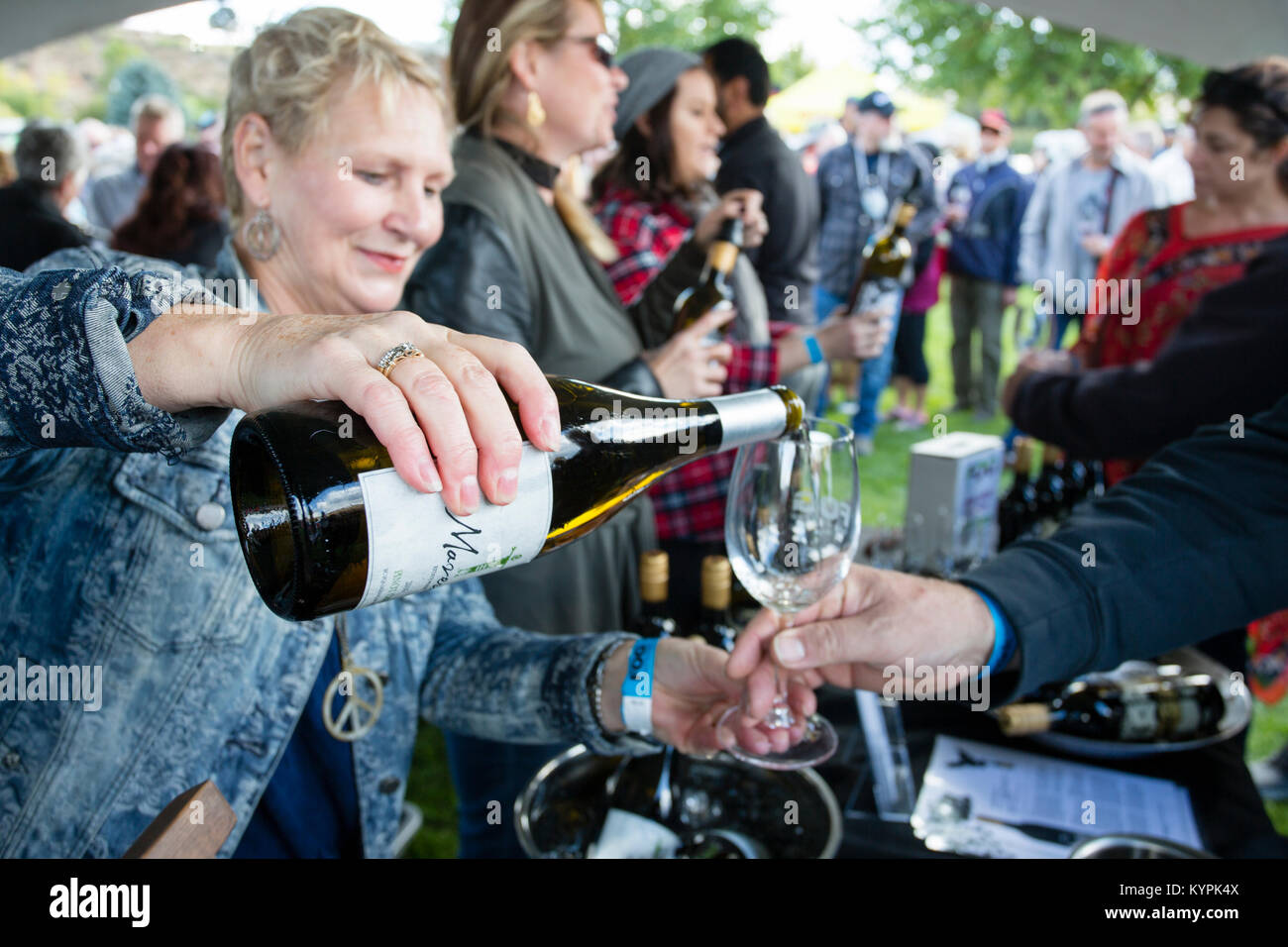 Visting attendees tasting the various wines that are on display at the ...