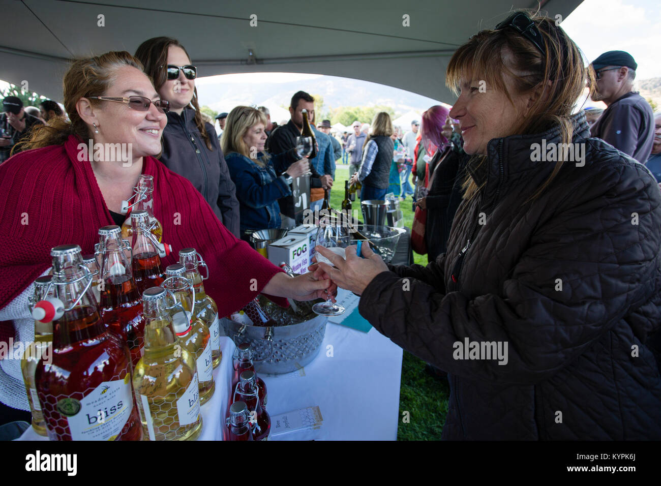 Visting attendees tasting the various wines that are on display at the ...