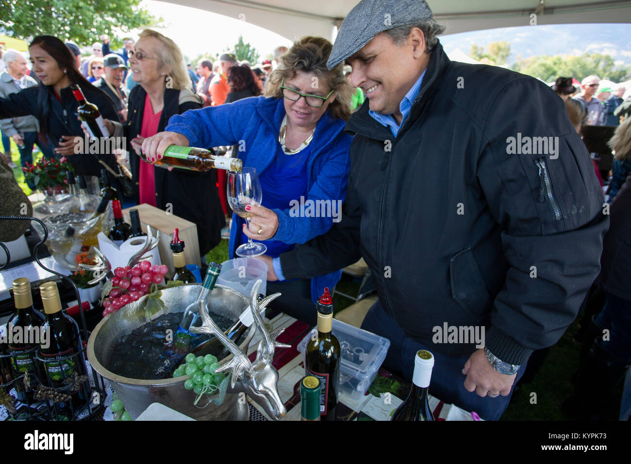 Visting attendees tasting the various wines that are on display at the ...