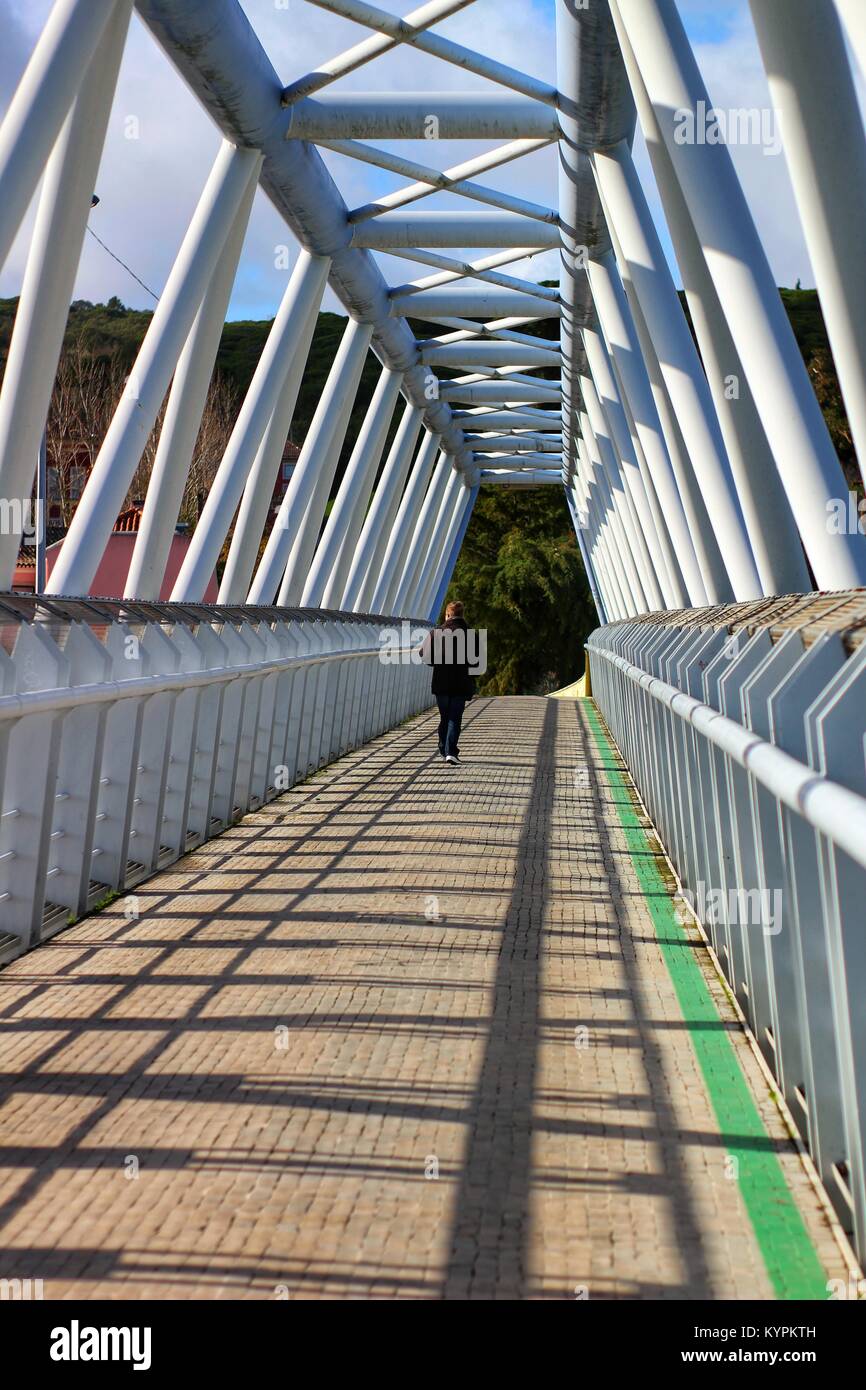 White iron bridge over train tracks in Lisbon, Portugal Stock Photo - Alamy