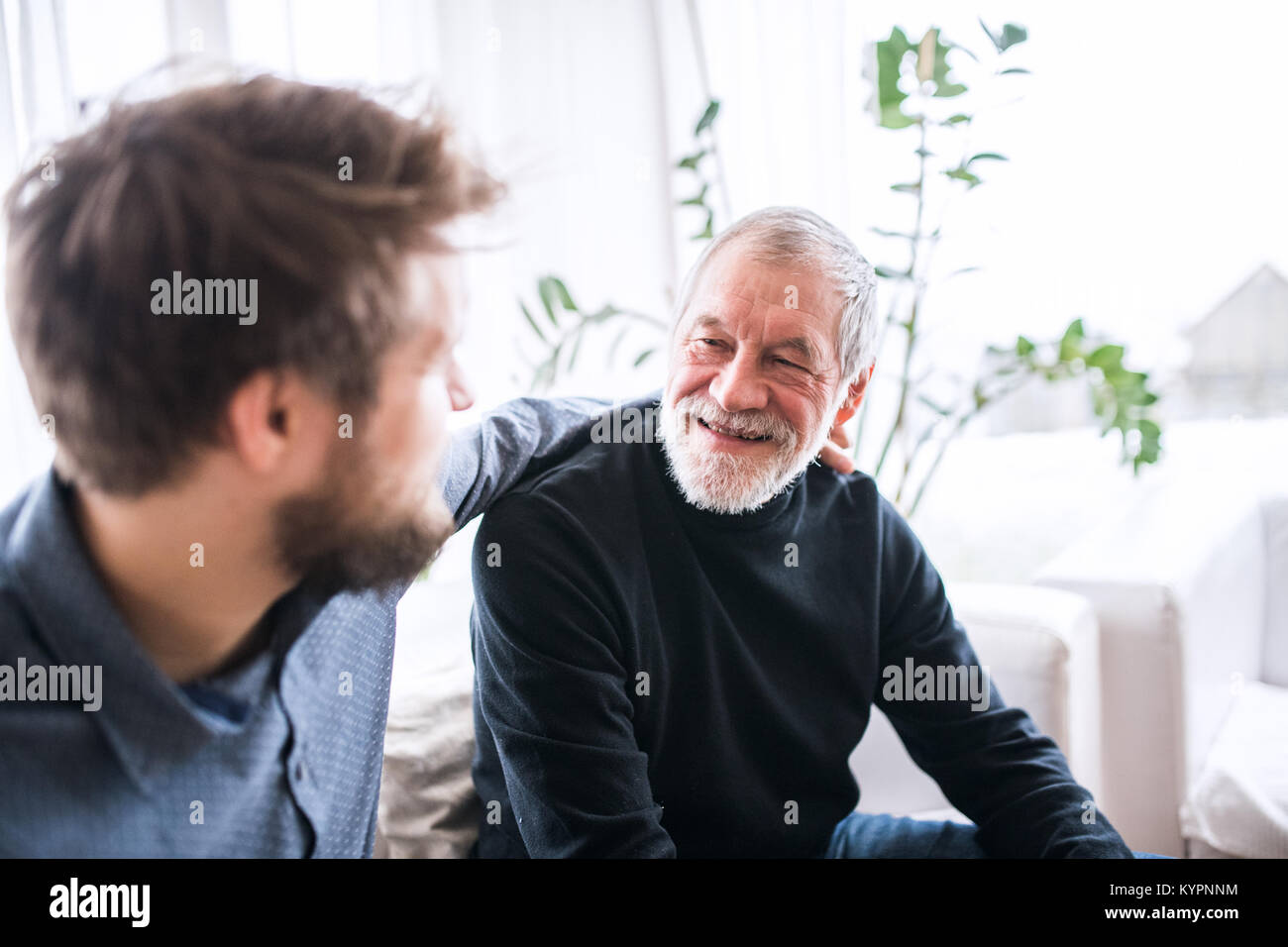 Hipster son and his senior father at home Stock Photo - Alamy