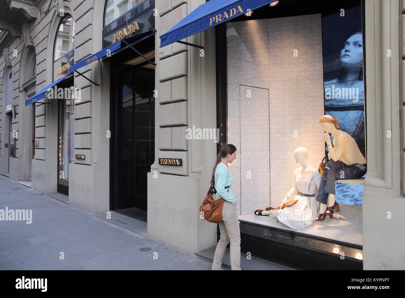 FLORENCE, ITALY - APRIL 30, 2015: Tourist visits Prada fashion store in ...