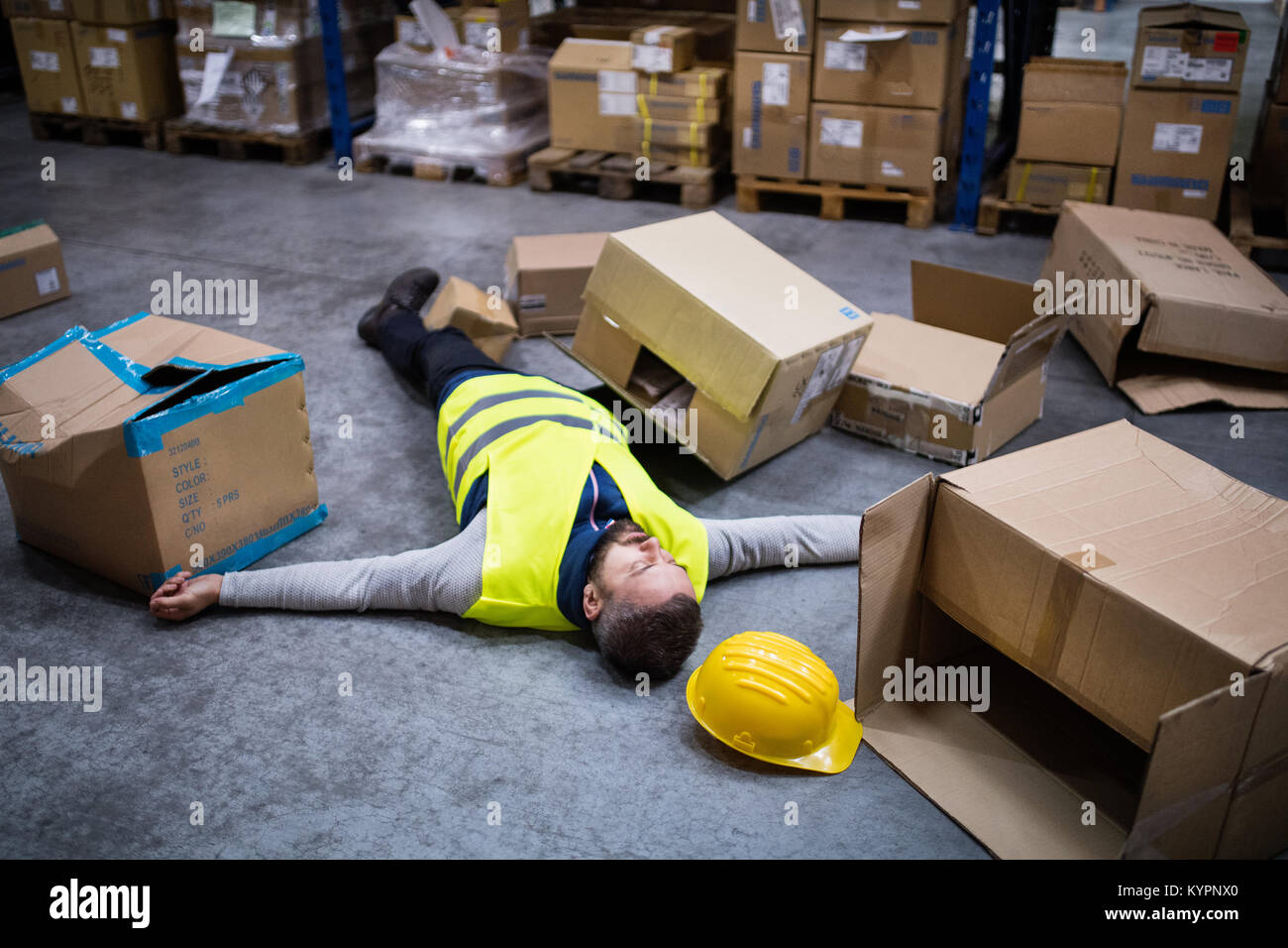 Warehouse worker after an accident in a warehouse Stock Photo - Alamy