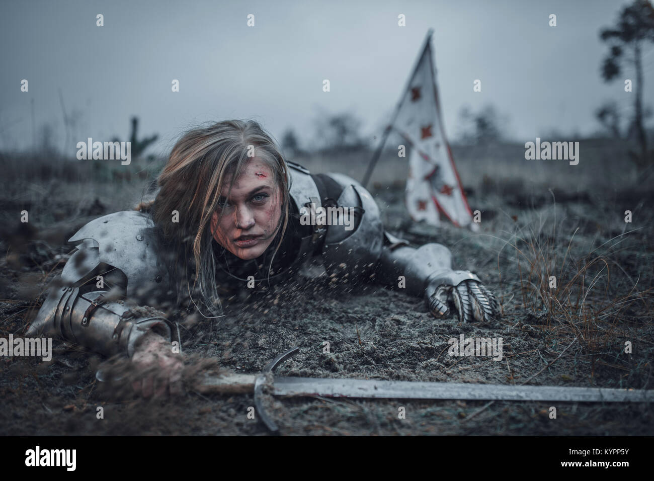 Girl with wounds on her face in image of Jeanne d'Arc in armor crawls ...
