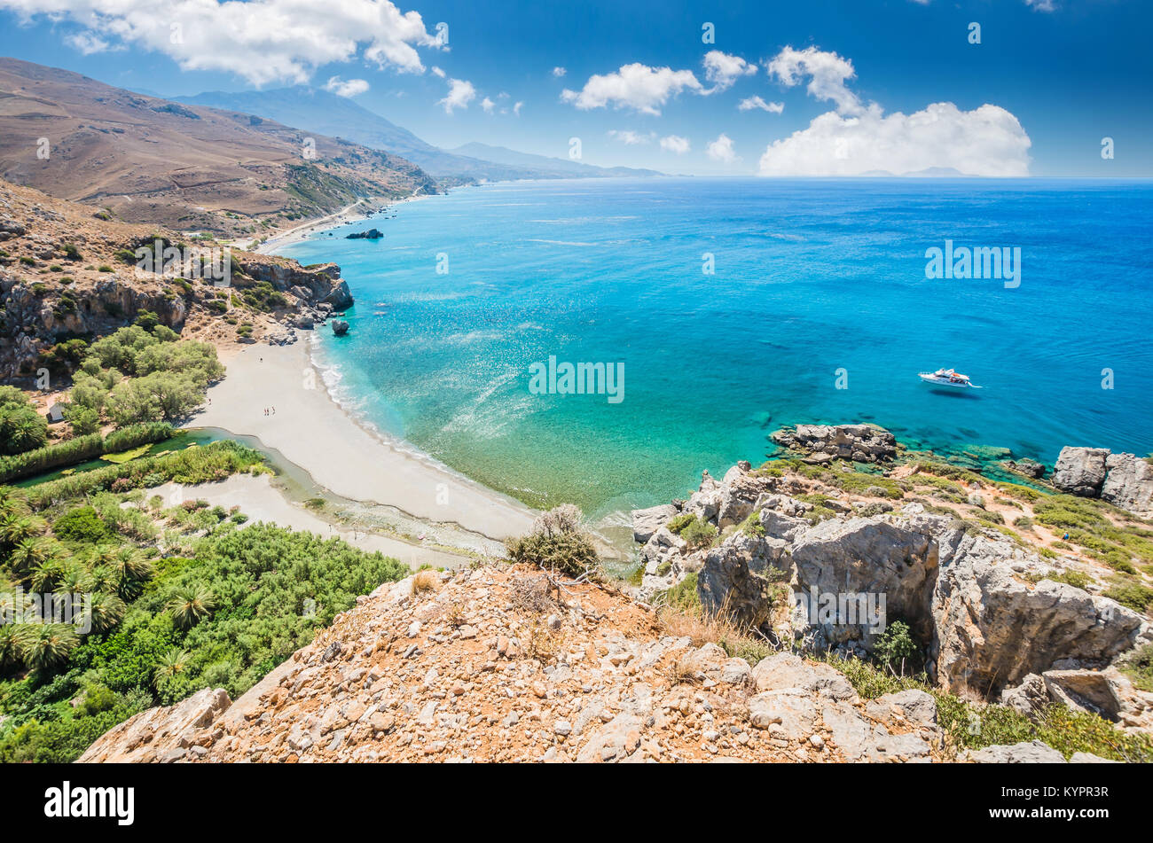 Preveli Beach in Crete island, Greece. There is a palm forest and a ...