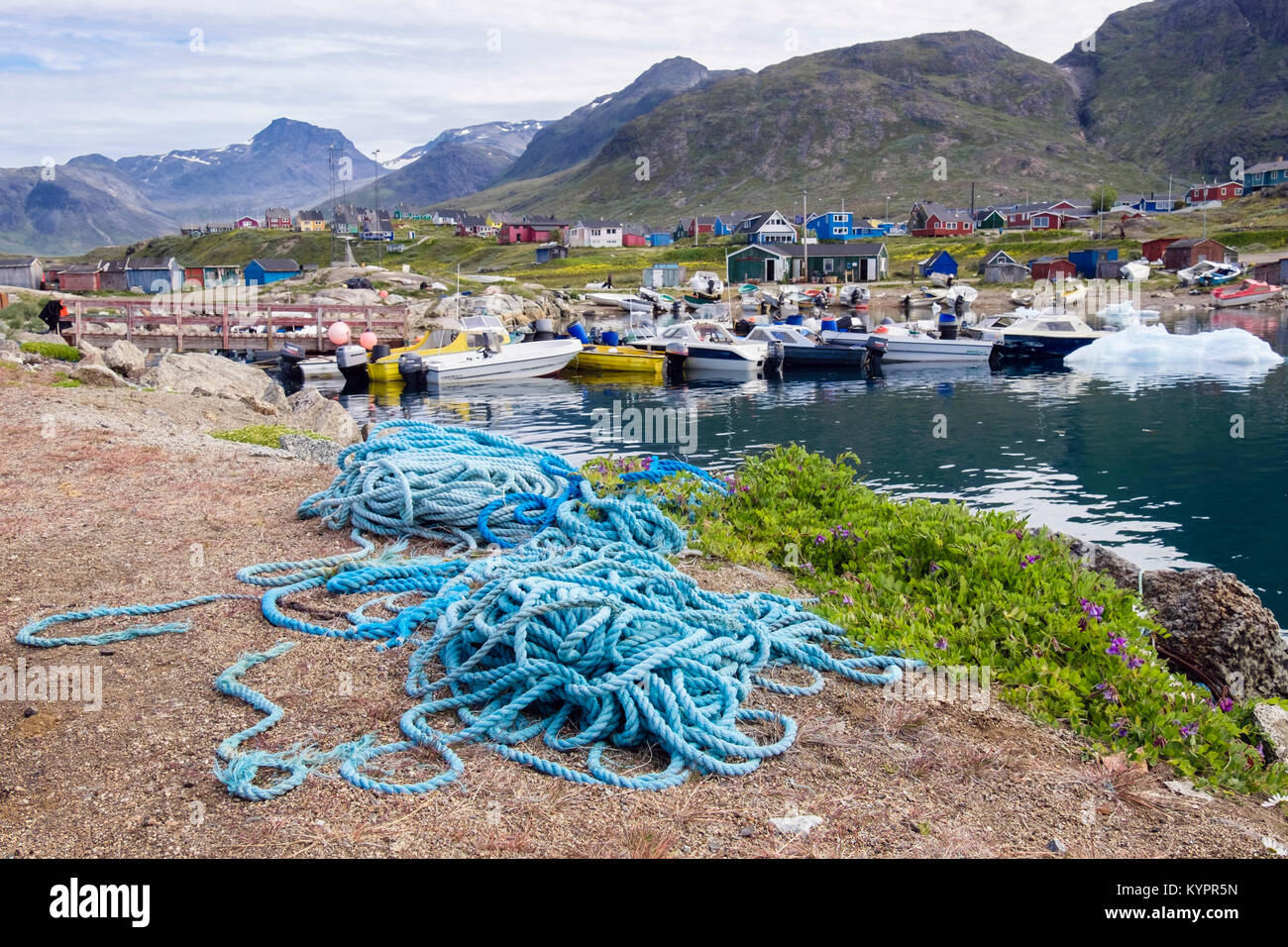 Small Inuit fishing boats and rope in Qajaq Harbour on coast in summer ...
