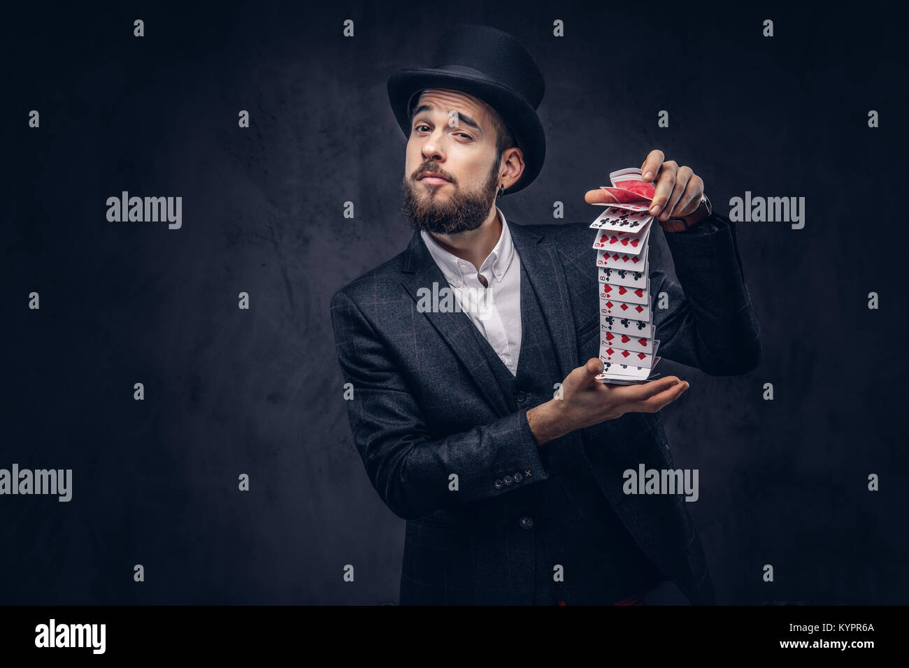 Magician showing trick with playing cards Stock Photo - Alamy