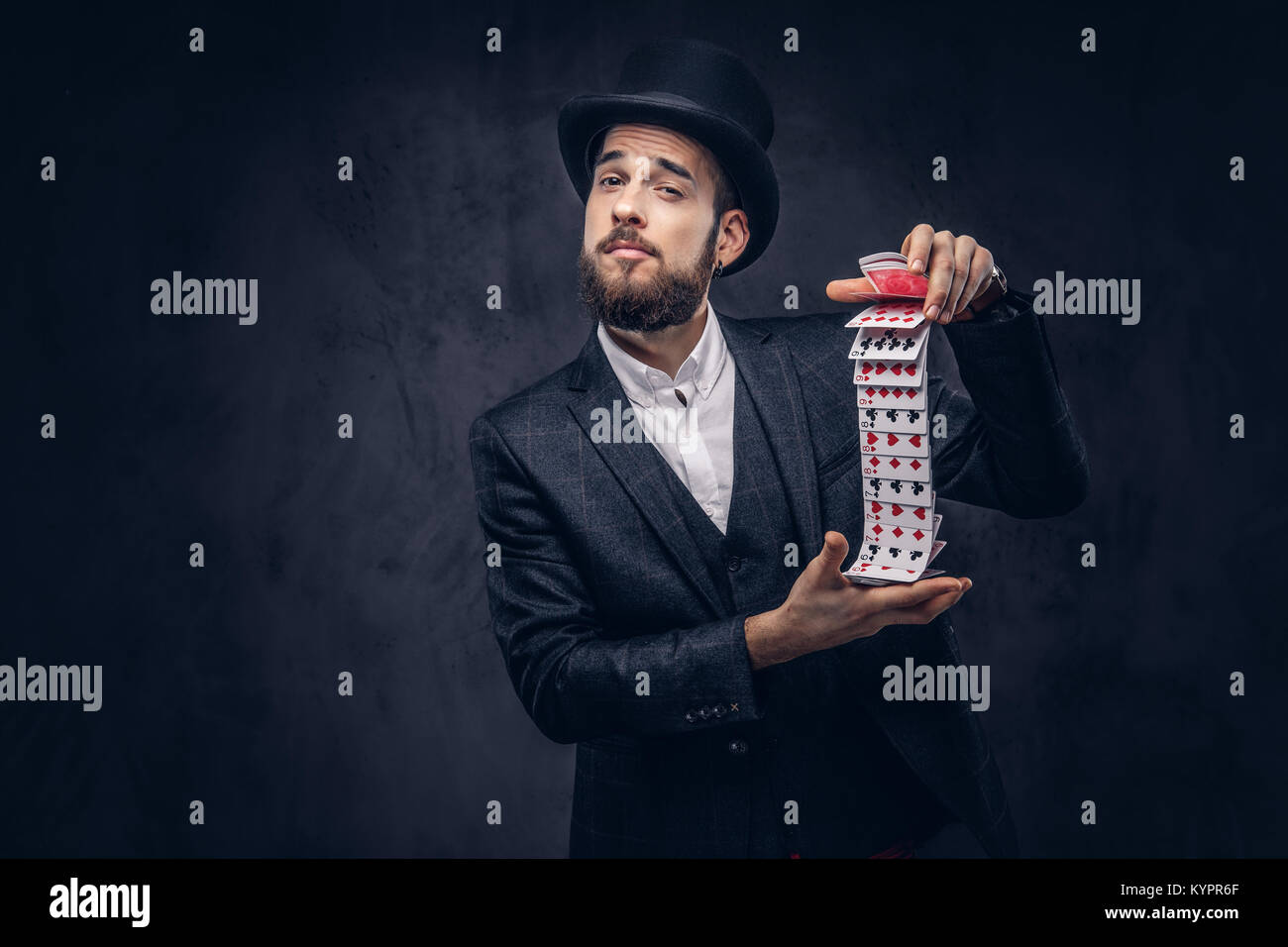 Magician showing trick with playing cards Stock Photo - Alamy