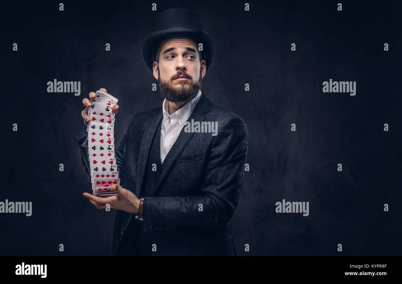 Magician showing trick with playing cards Stock Photo - Alamy