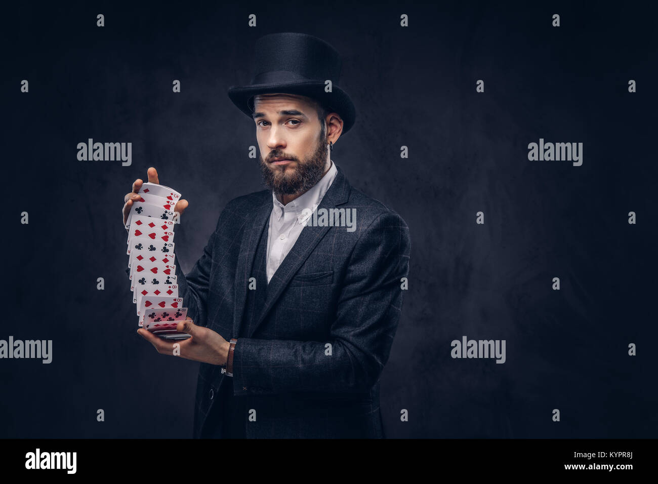 Magician showing trick with playing cards Stock Photo - Alamy