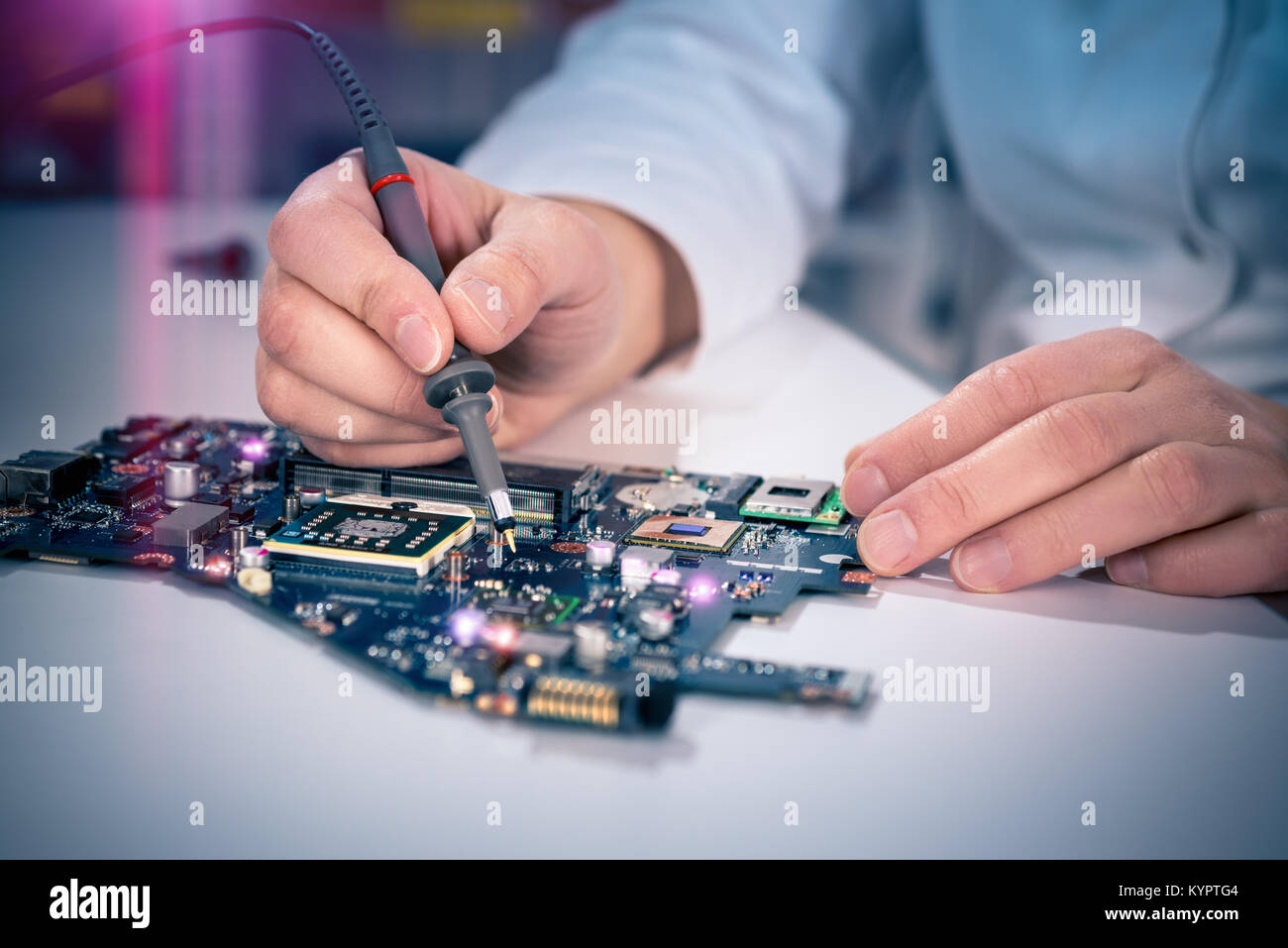 Repairman fixes electronic equipment hi-res stock photography and ...