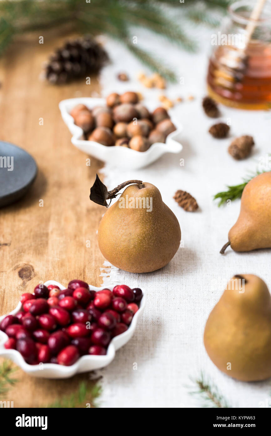 Pears and cranberries on a table Stock Photo - Alamy