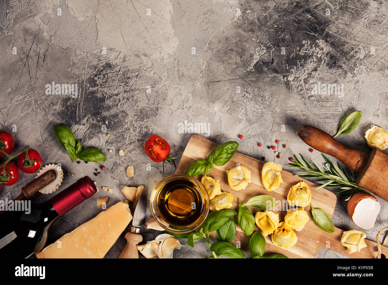 Italian food background with ravioli, vine tomatoes, basil, spaghetti ...