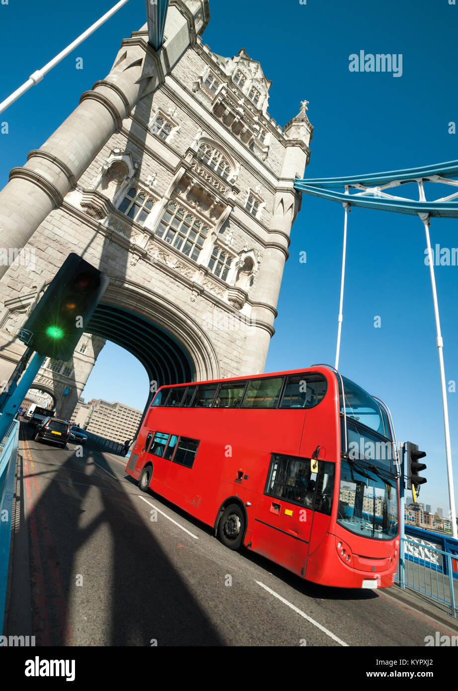Red London bus on Tower Bridge in London Stock Photo - Alamy