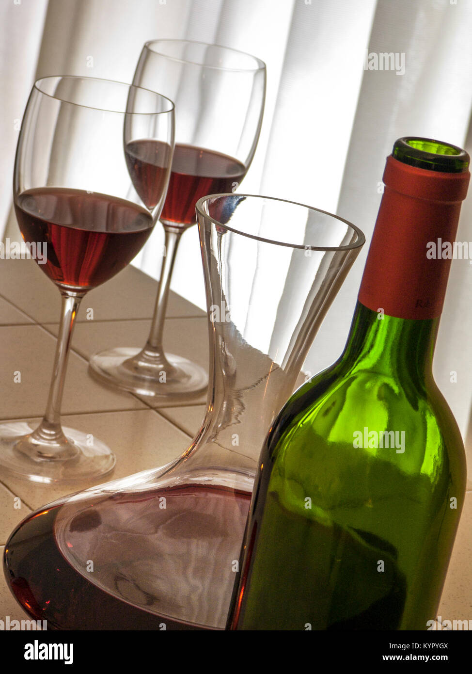 WINE DECANTER DECANTING DECANTED Bottle of red wine decanted into ...